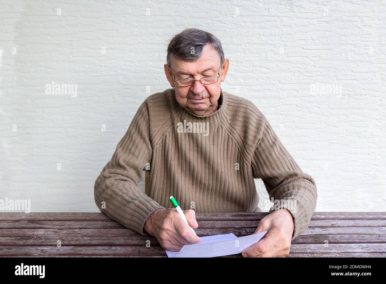 Man writing in bill book hi-res stock photography and images - Alamy