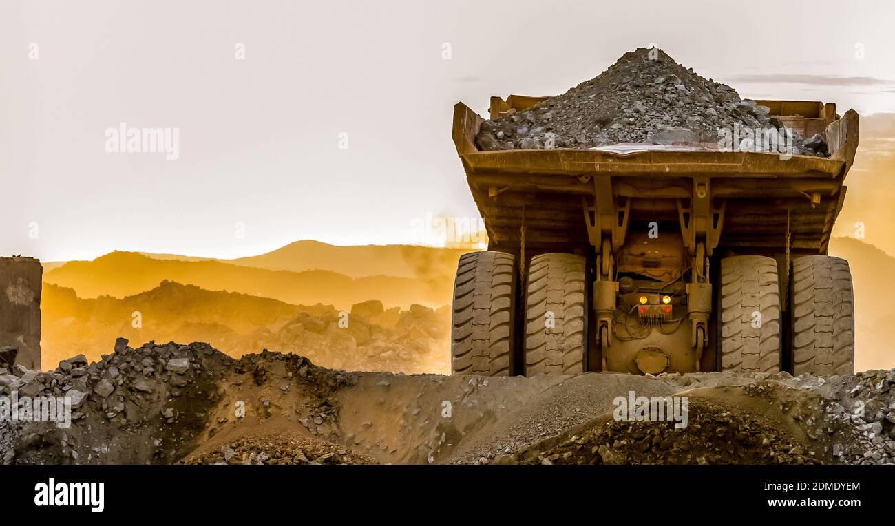 A large rock dump truck transporting Stock Photo - Alamy