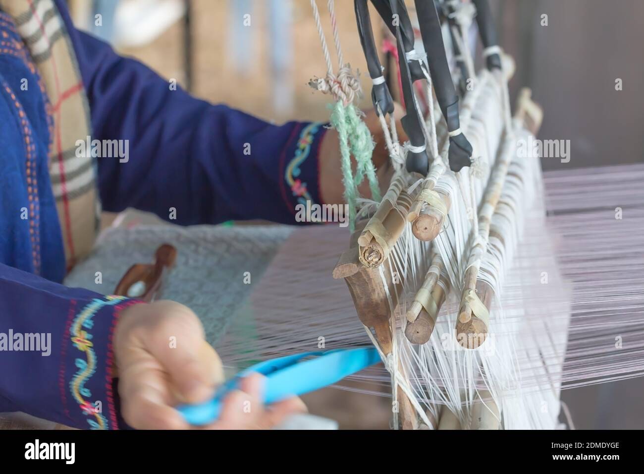 Asian woman on weaving machine hi-res stock photography and images - Alamy
