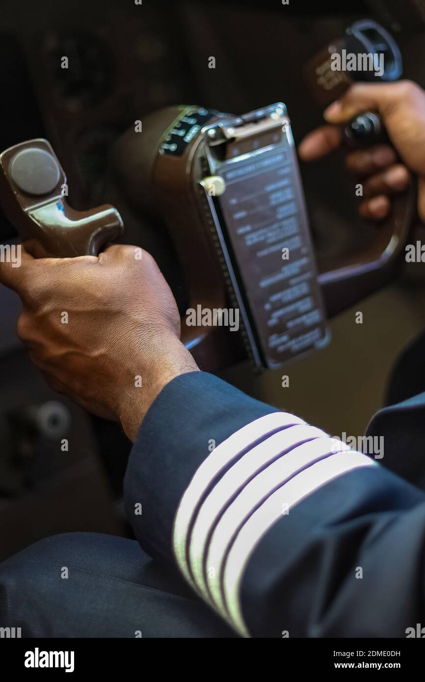 A vertical shot of a pilot's hands controlling the airplane Stock Photo ...