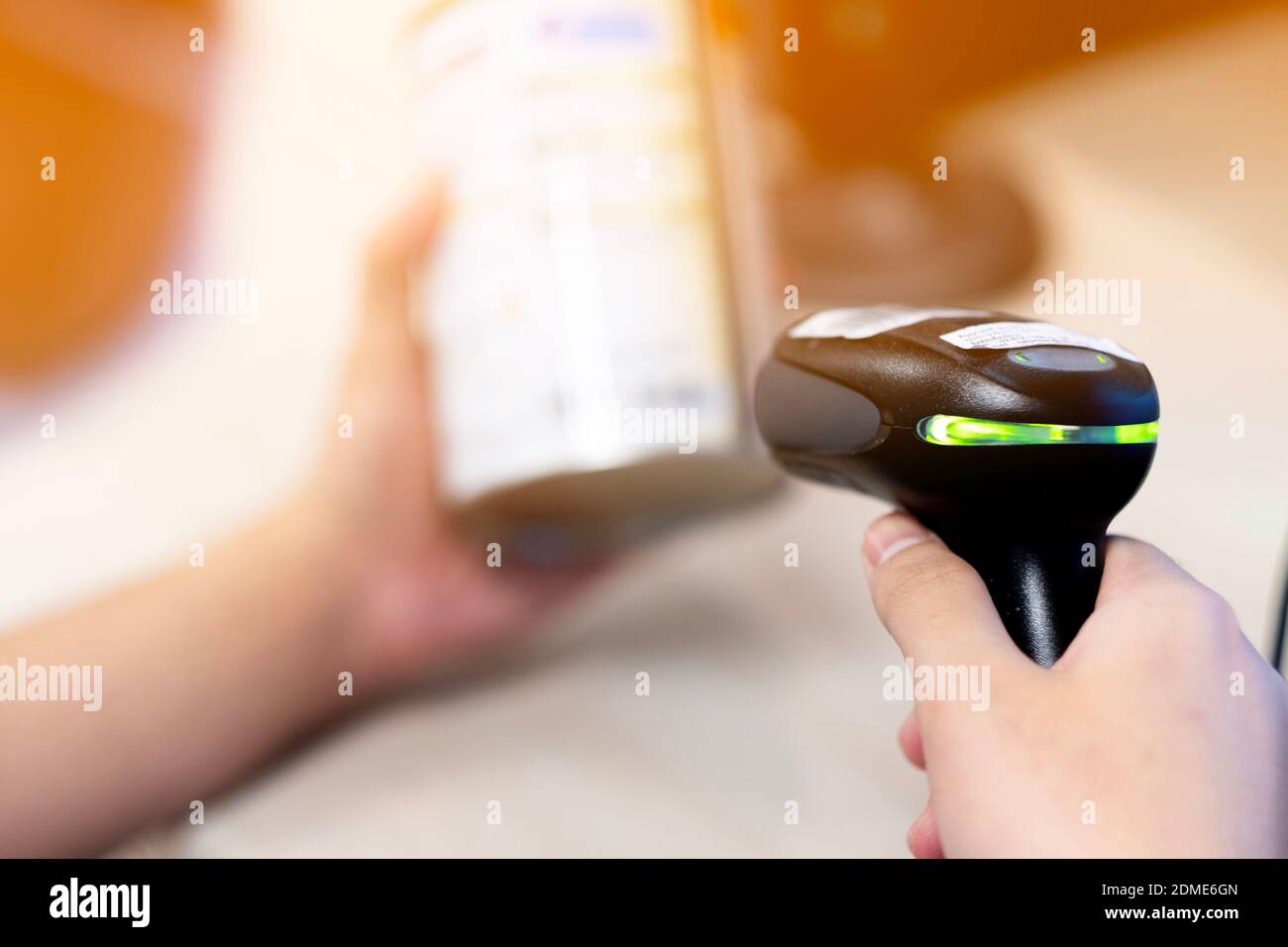 Pharmacist scanning barcode of drug in a pharmacy Stock Photo - Alamy
