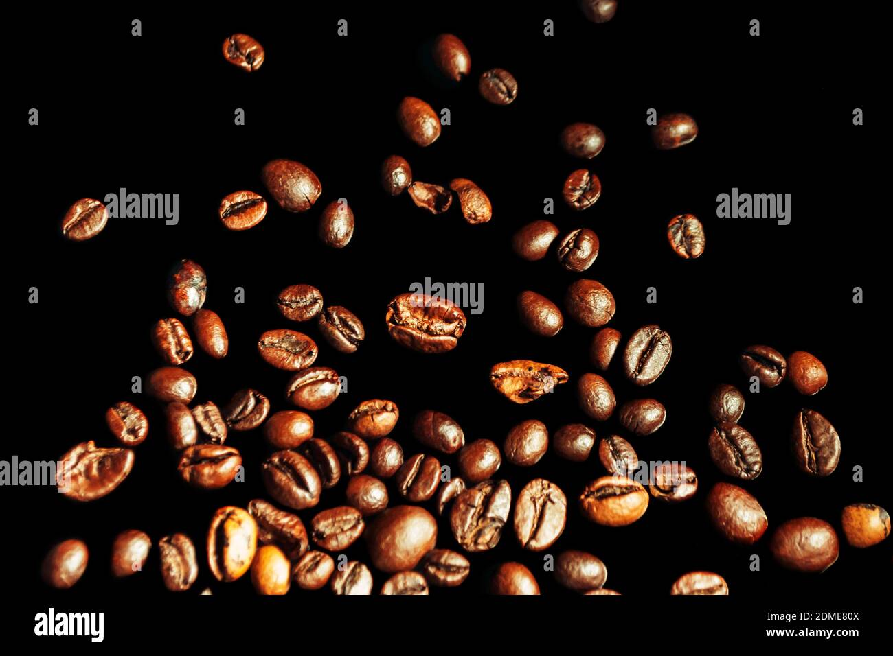 Falling coffee beans isolated on black background in low key,clipping ...