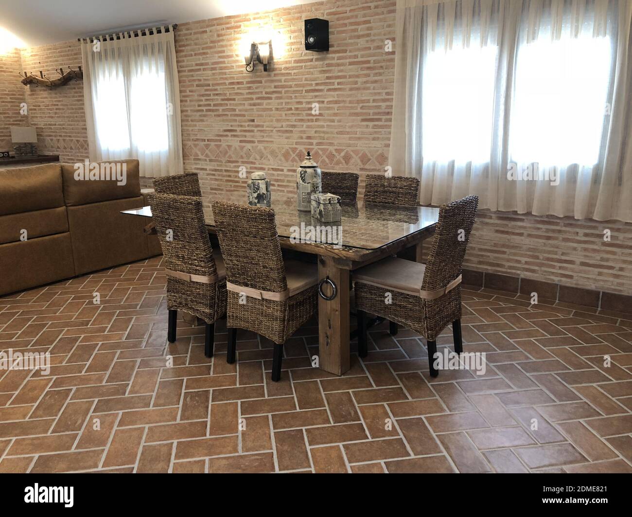 A modern rural living room interior with brick-made wall and ...