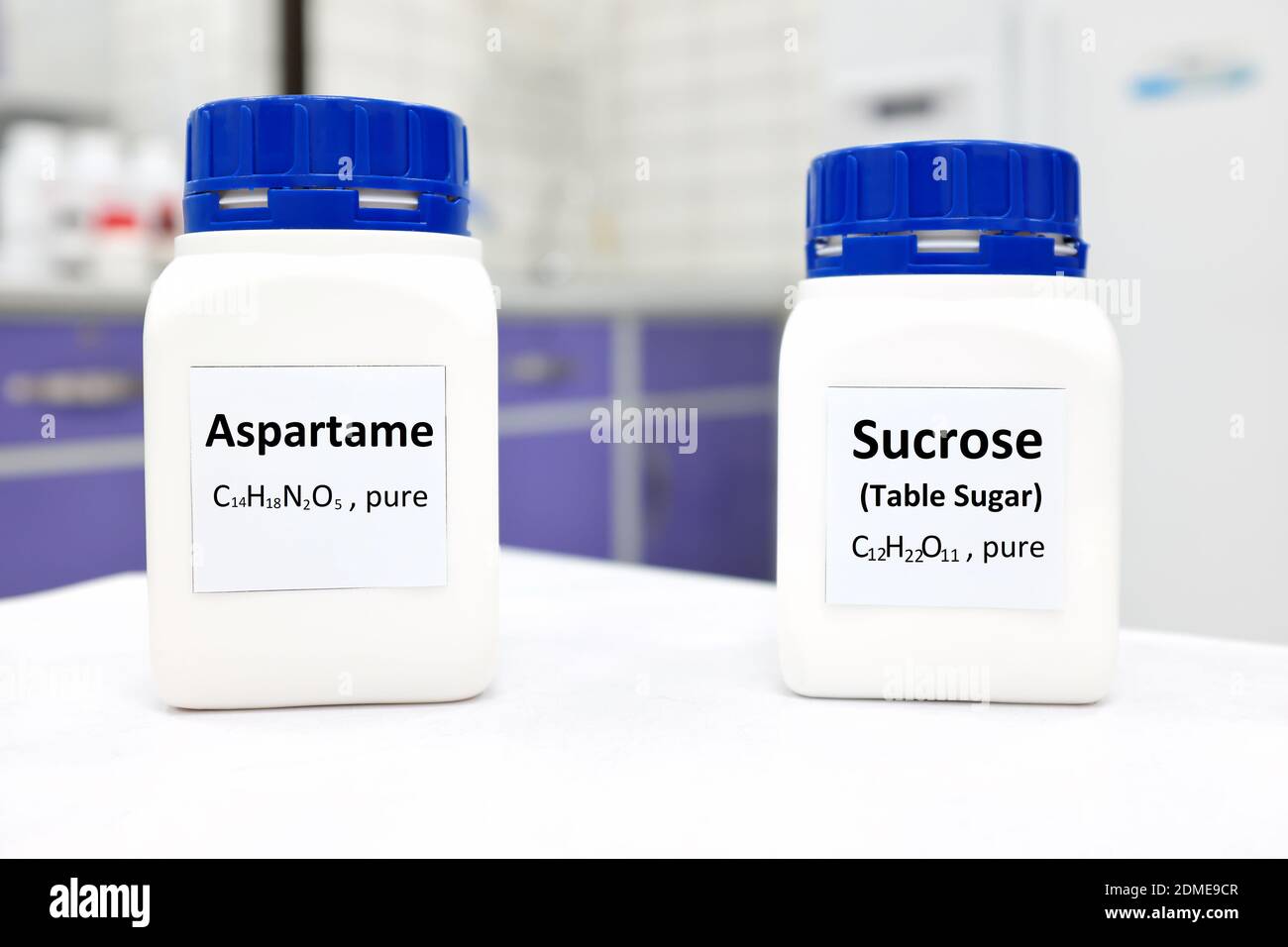 Selective focus of a bottle of pure aspartame artificial sweetener and ...