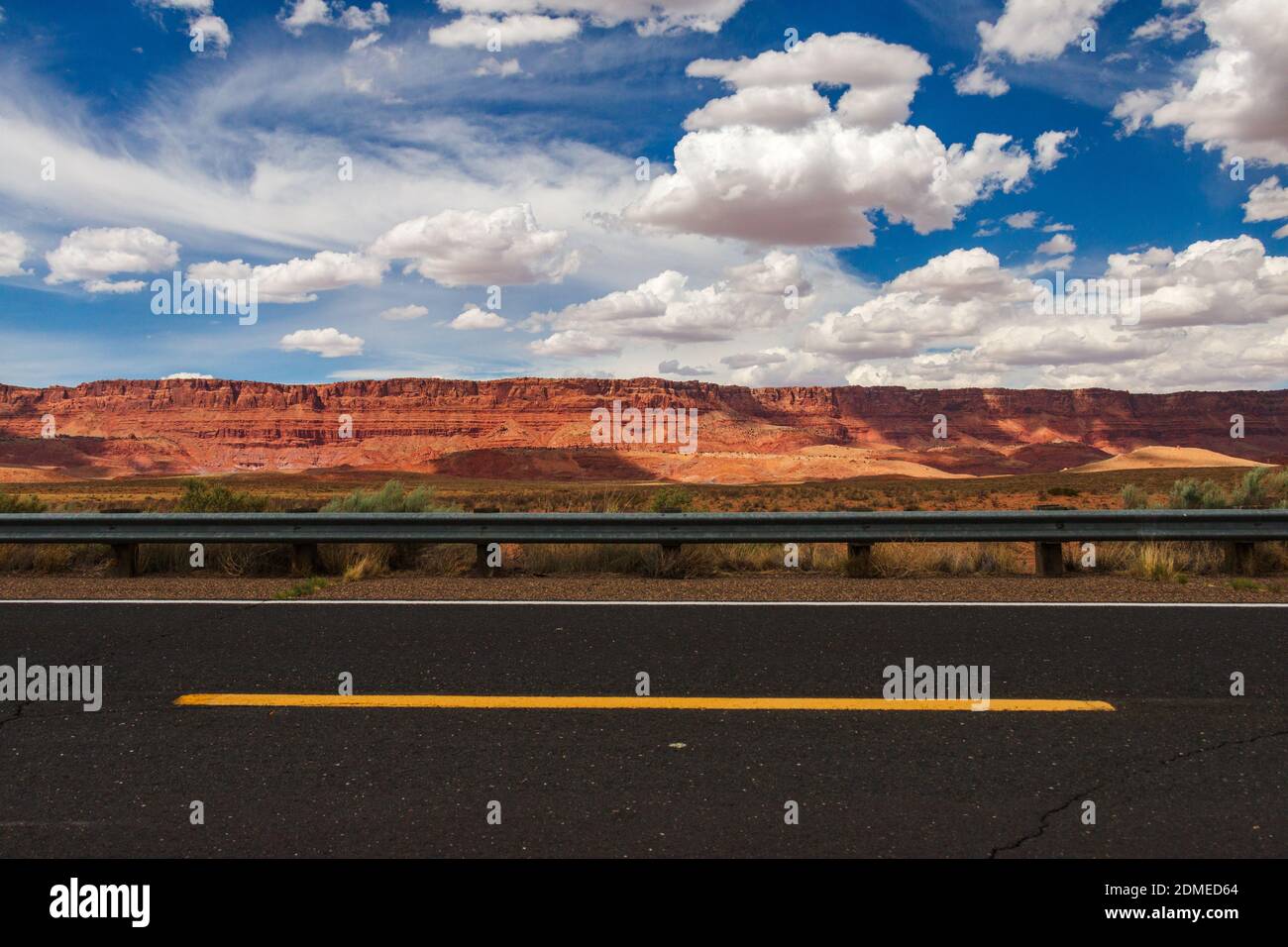 Empty road in the Arizona desert with big clouds and blue sky Stock ...