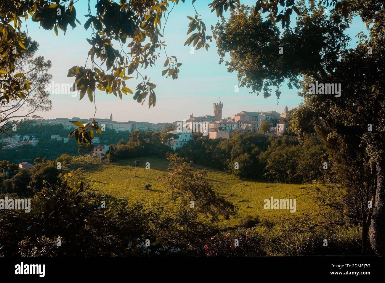 A beautiful view of a town with fortress castles through the tree ...