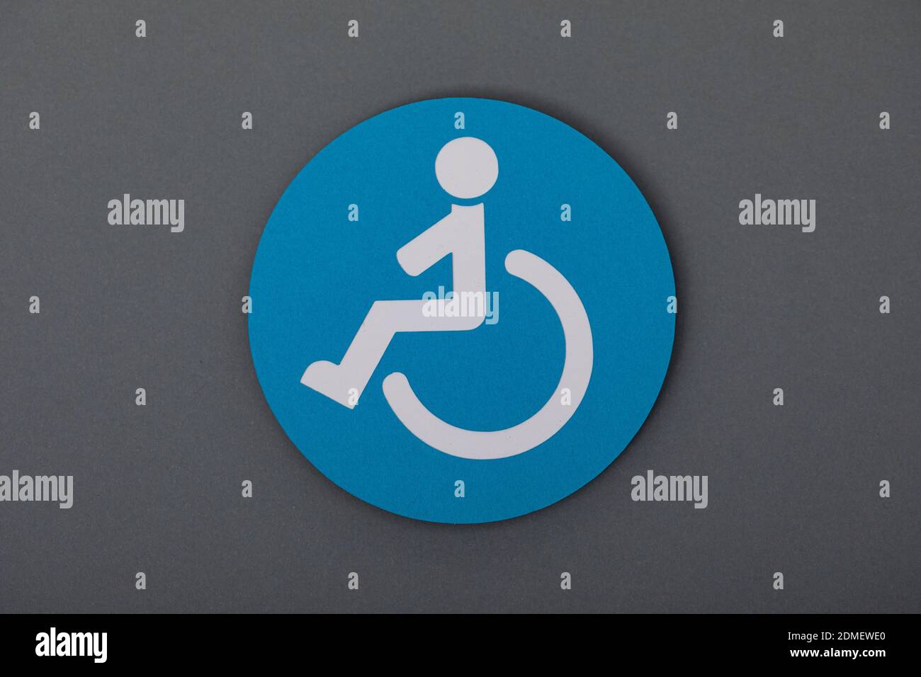The blue sign of a disability wheelchair from a paper cut Stock Photo ...
