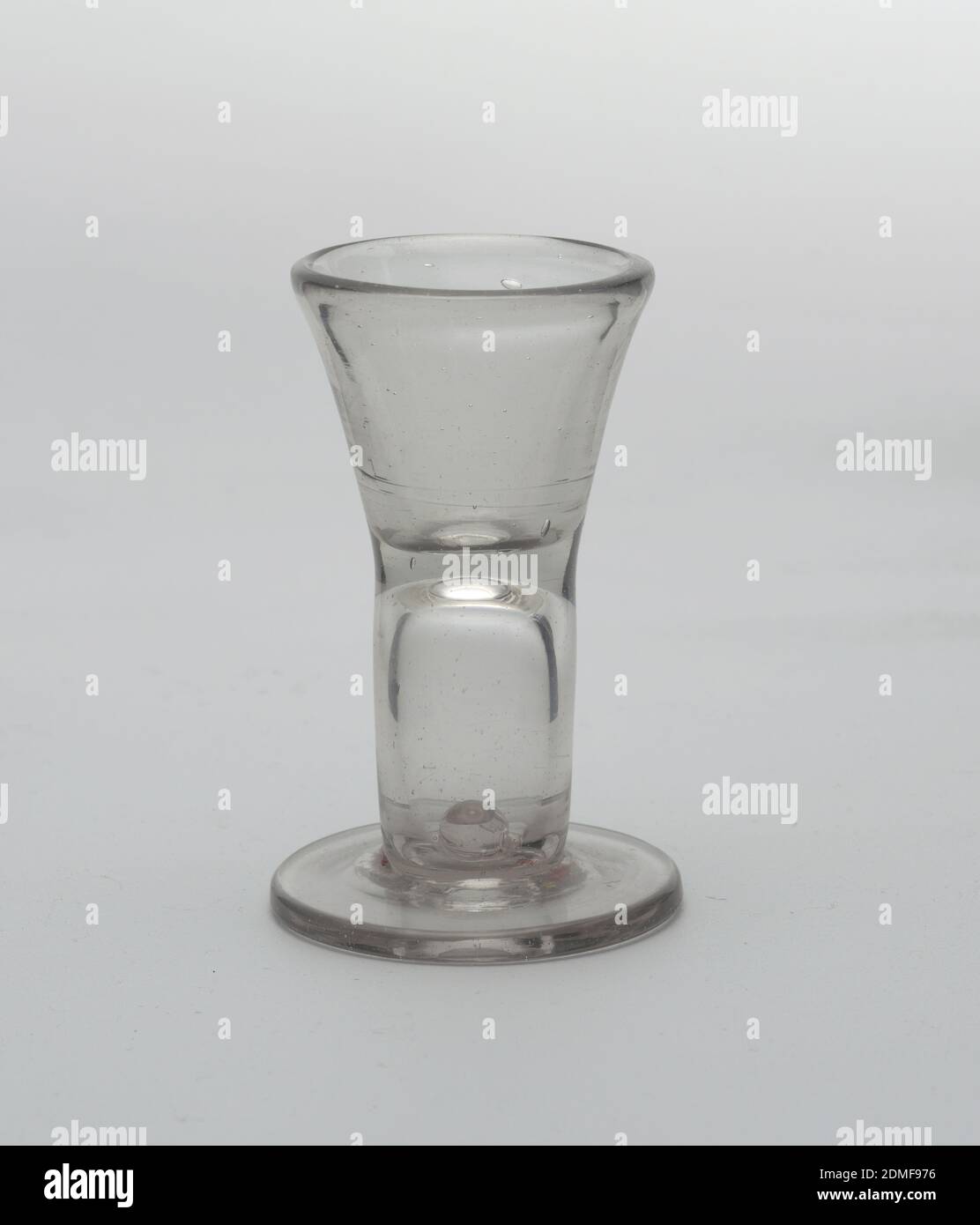 Firing glass, Free-blown glass, Flared form of thick, clear glass with ...