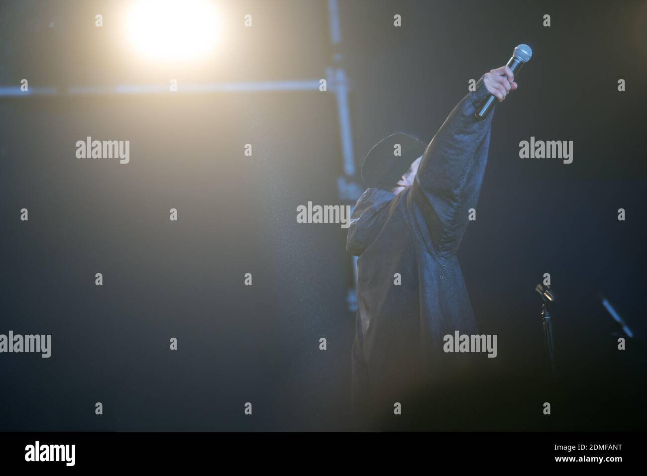 Performance arts culture and entertainment holding microphone standing ...