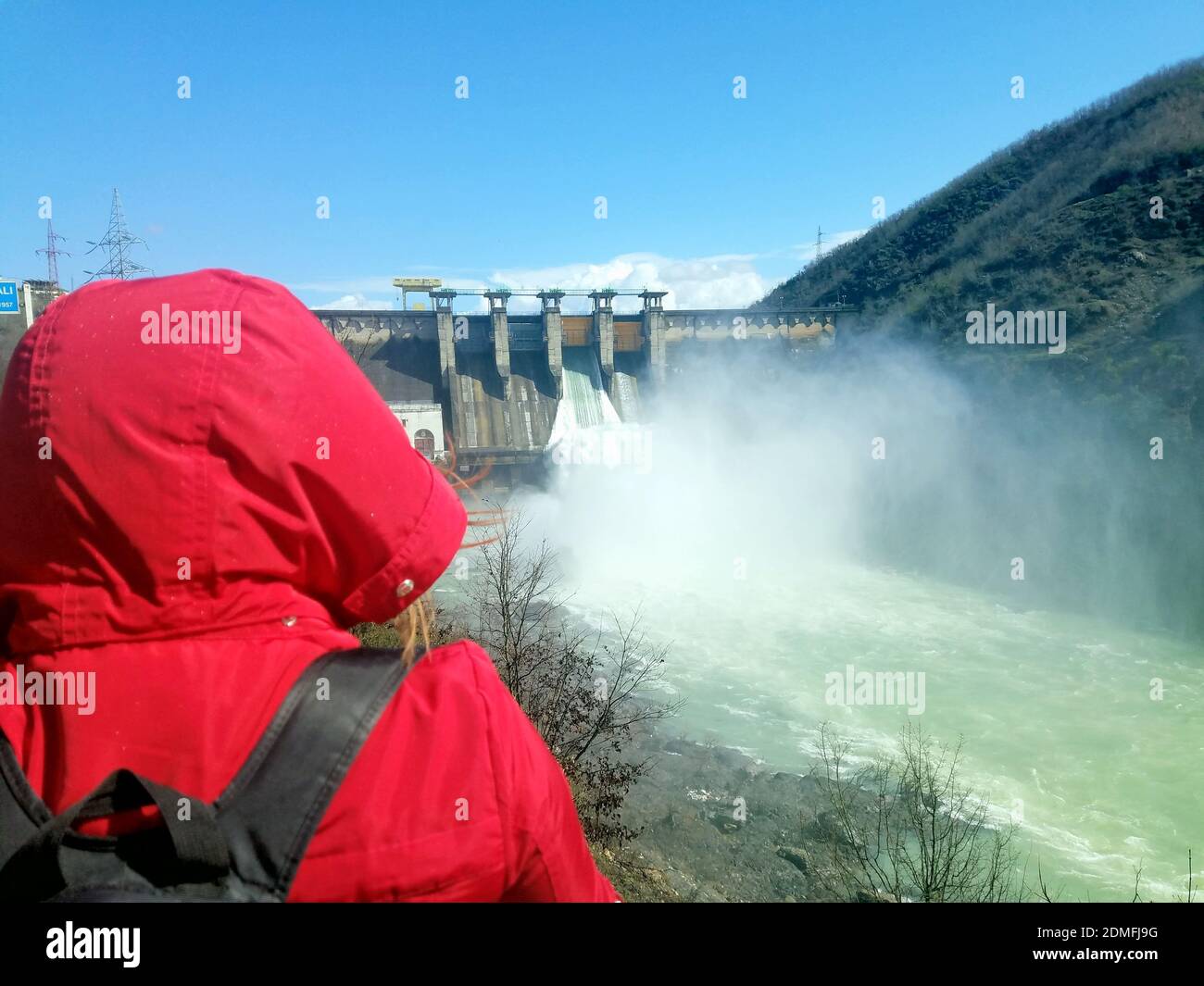 Rear View Of Woman Standing Against Dam Stock Photo - Alamy
