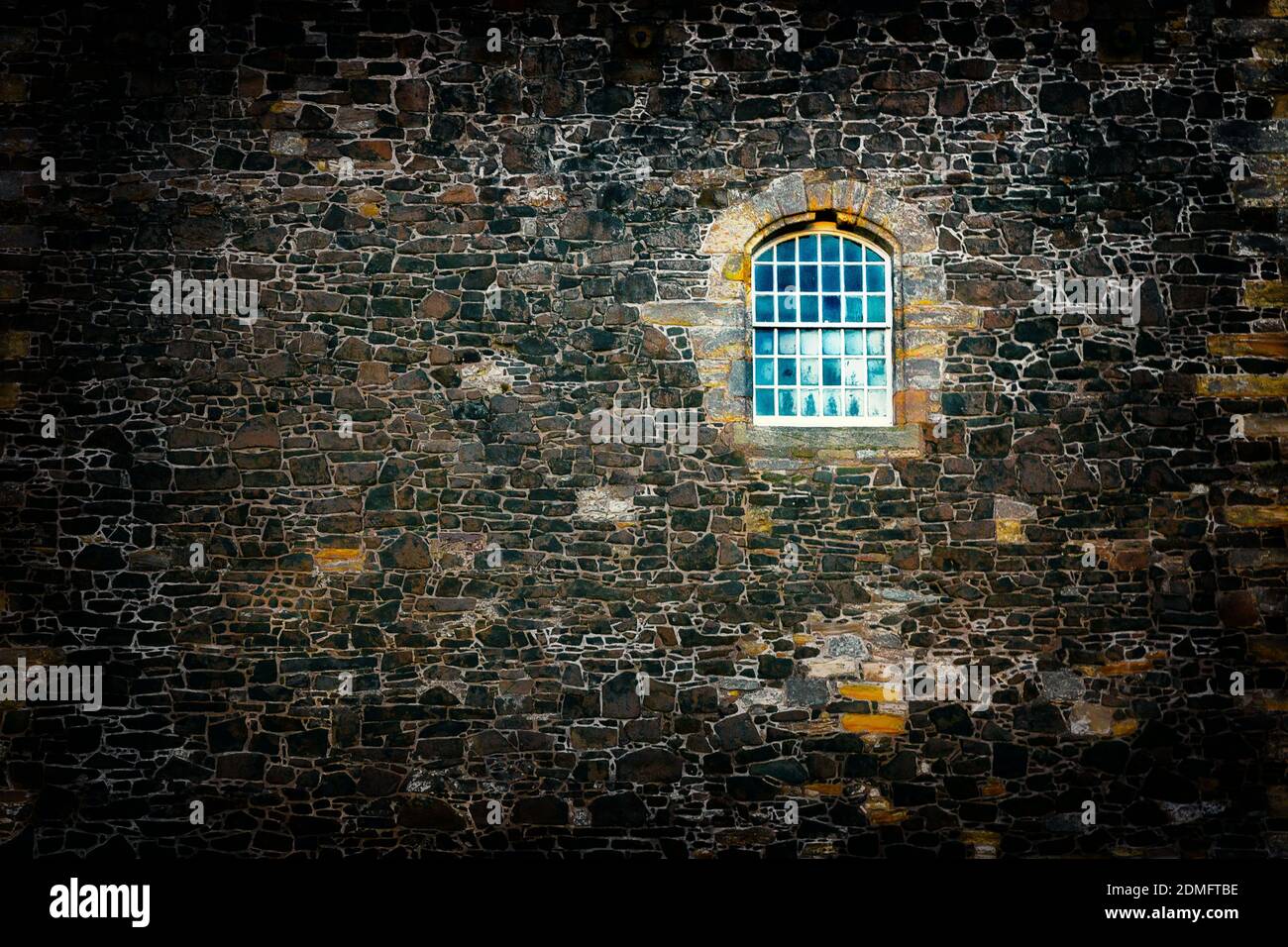 small window on a large brick wall Stock Photo - Alamy