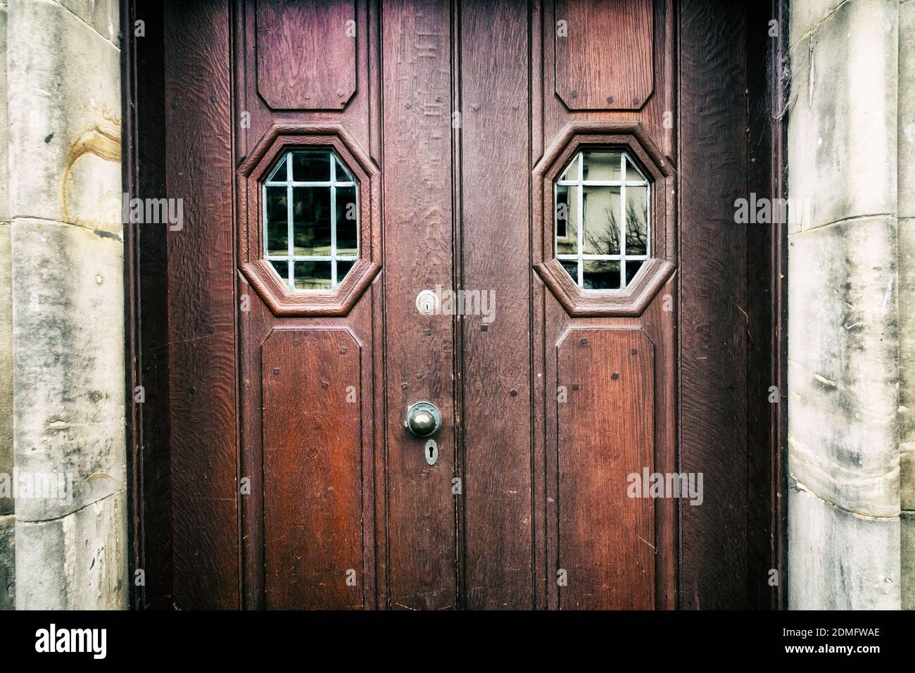 Wooden door with small windows Stock Photo - Alamy
