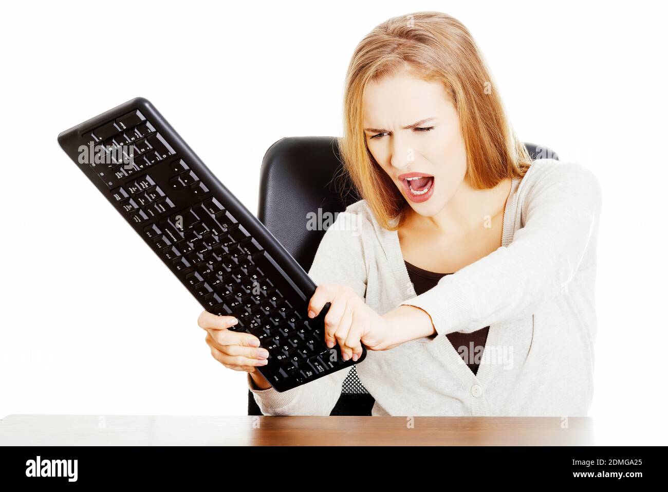 Angry Woman Breaking Keyboard Against White Background Stock Photo - Alamy