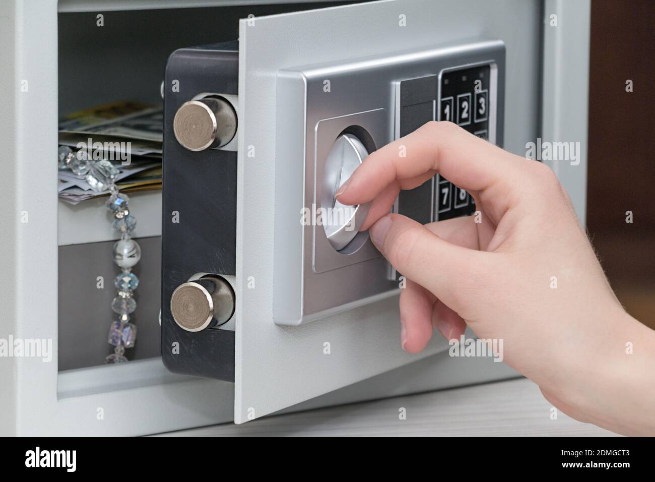 Opening locker hand hi-res stock photography and images - Alamy