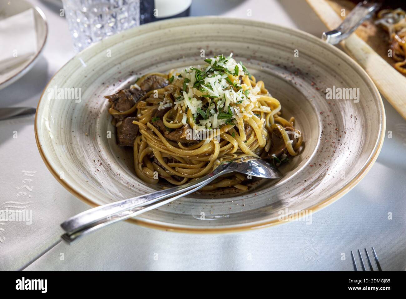A portion of delicious spaghetti with beef and cheese on top Stock ...