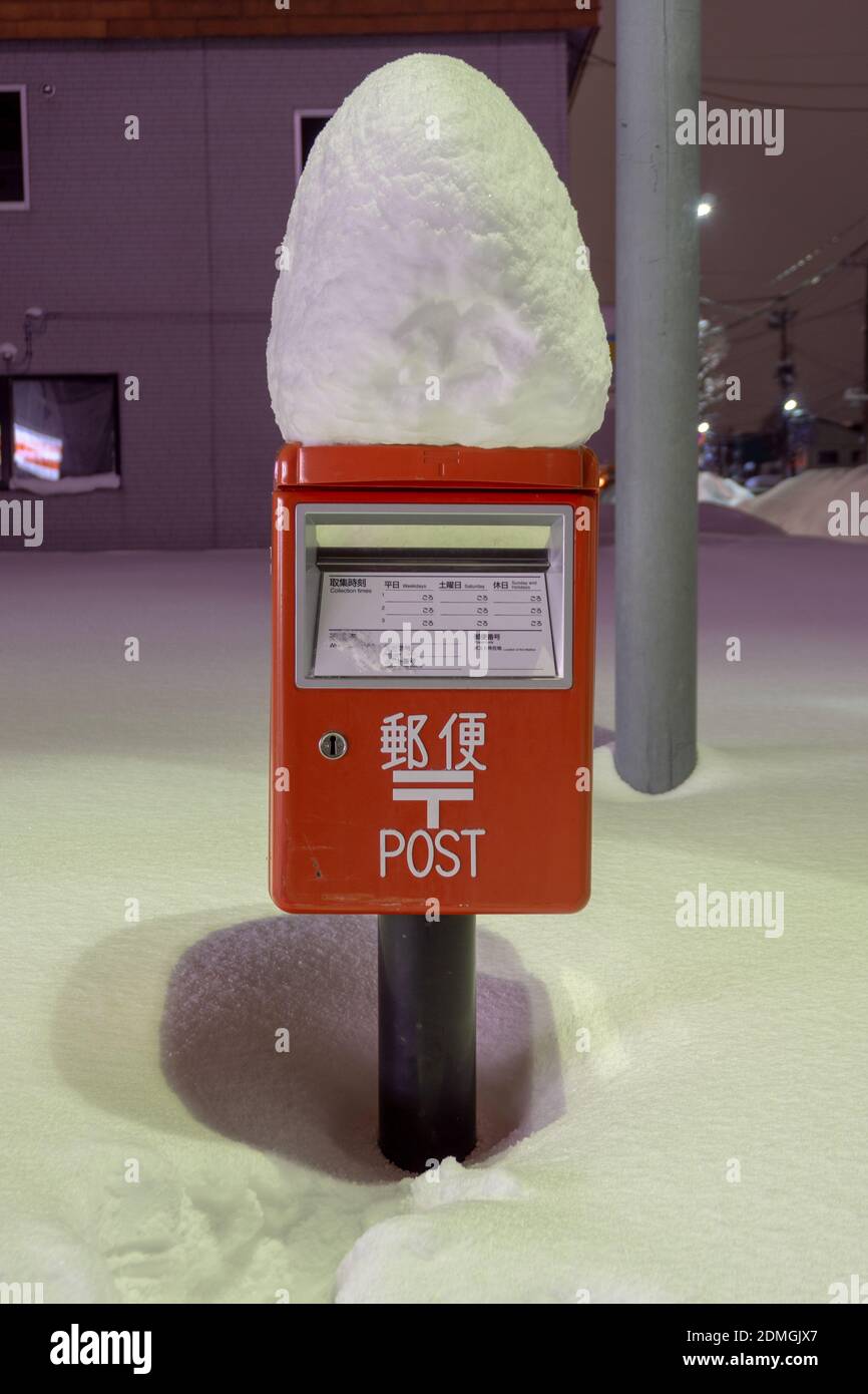 Post box with snow on top of it during heavy snowfall in Winter at ...