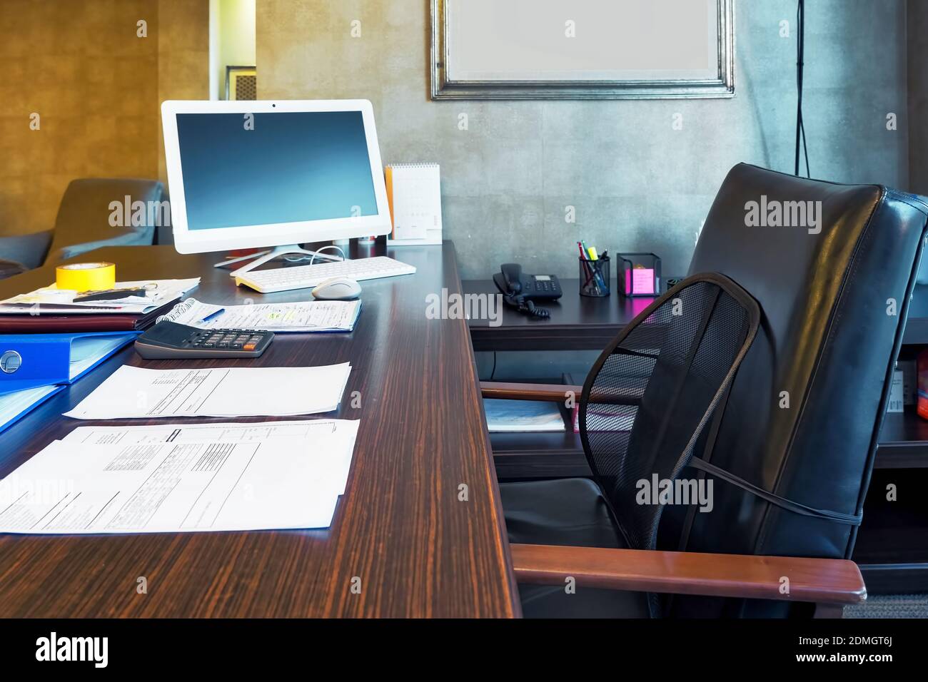 Office workplace or workspace with desk, chair, documents, calculator ...