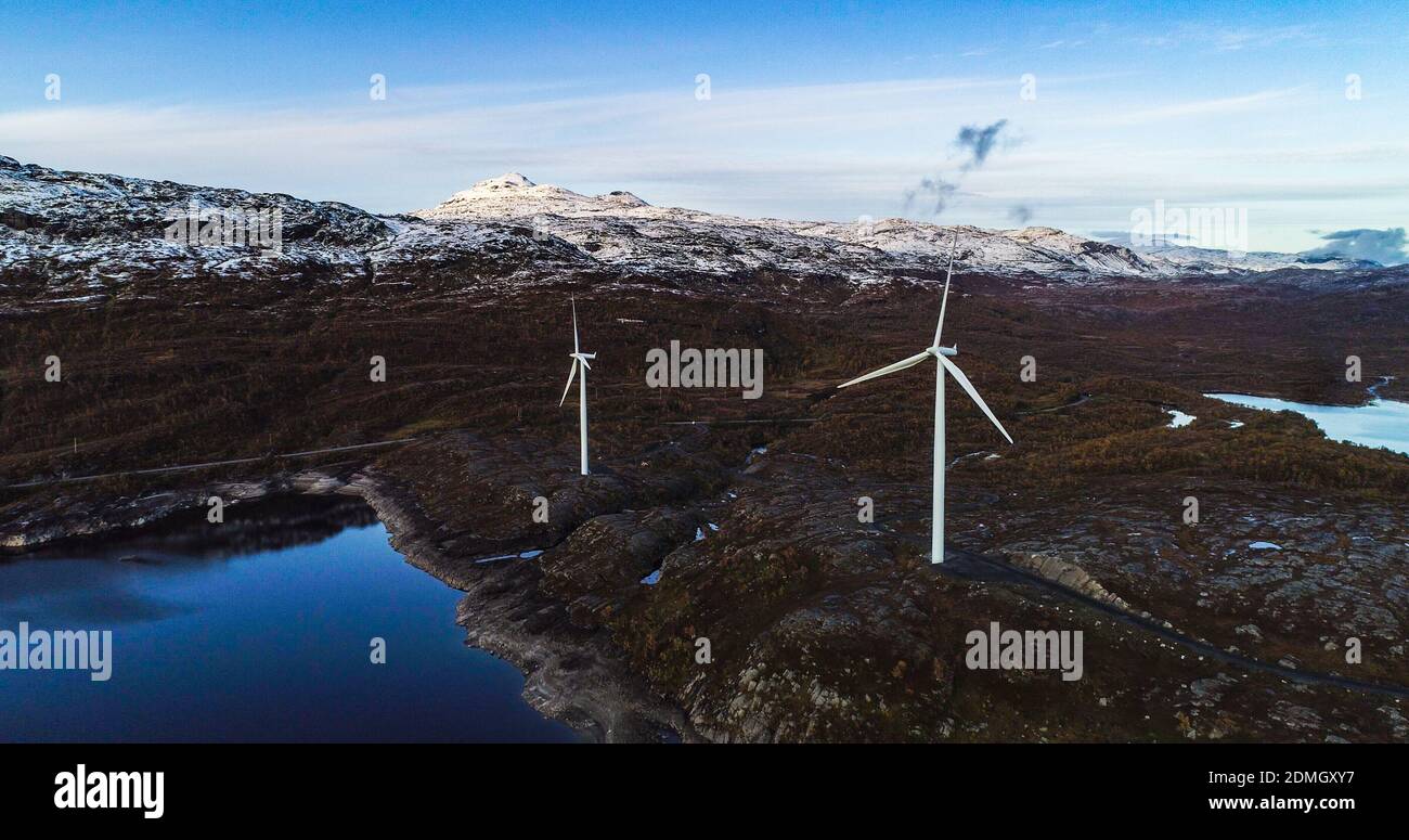 Aerial, drone shot of still windmills, in polar nature, cloudy, autumn ...