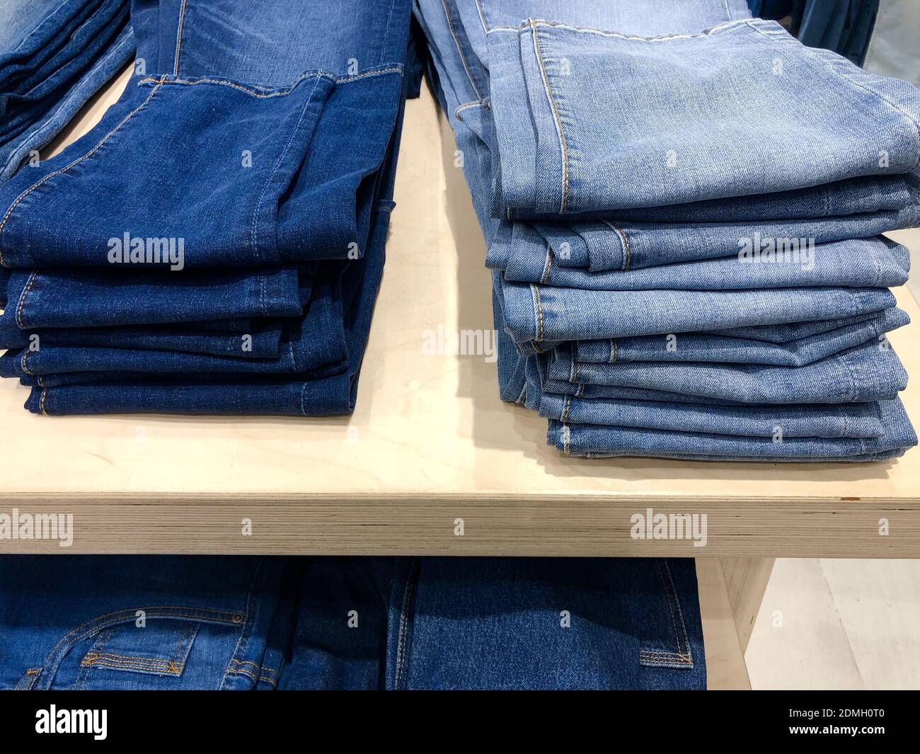 Blue jeans for men on sale in a store Stock Photo - Alamy