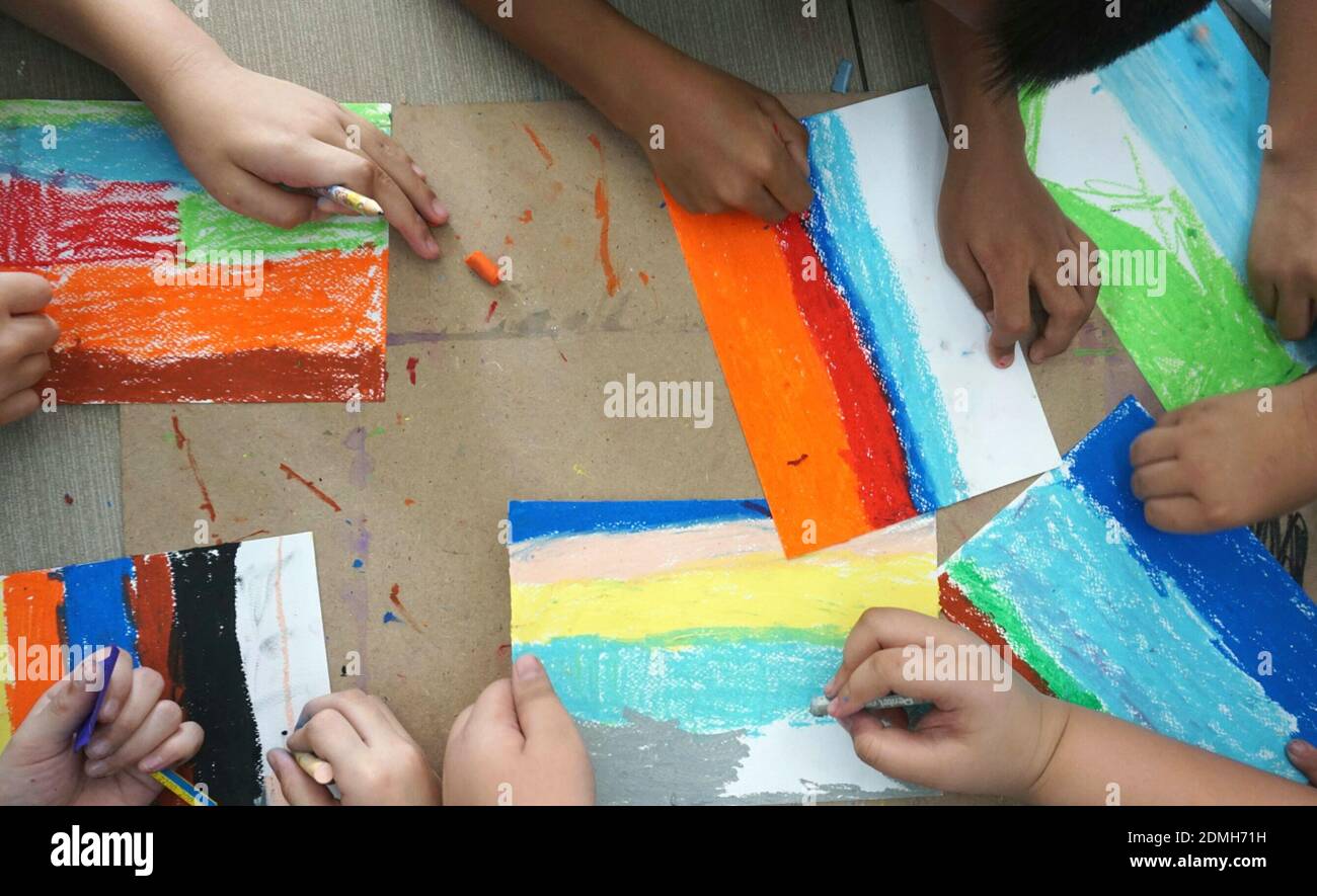 Hand holding crayon coloring hi-res stock photography and images - Alamy