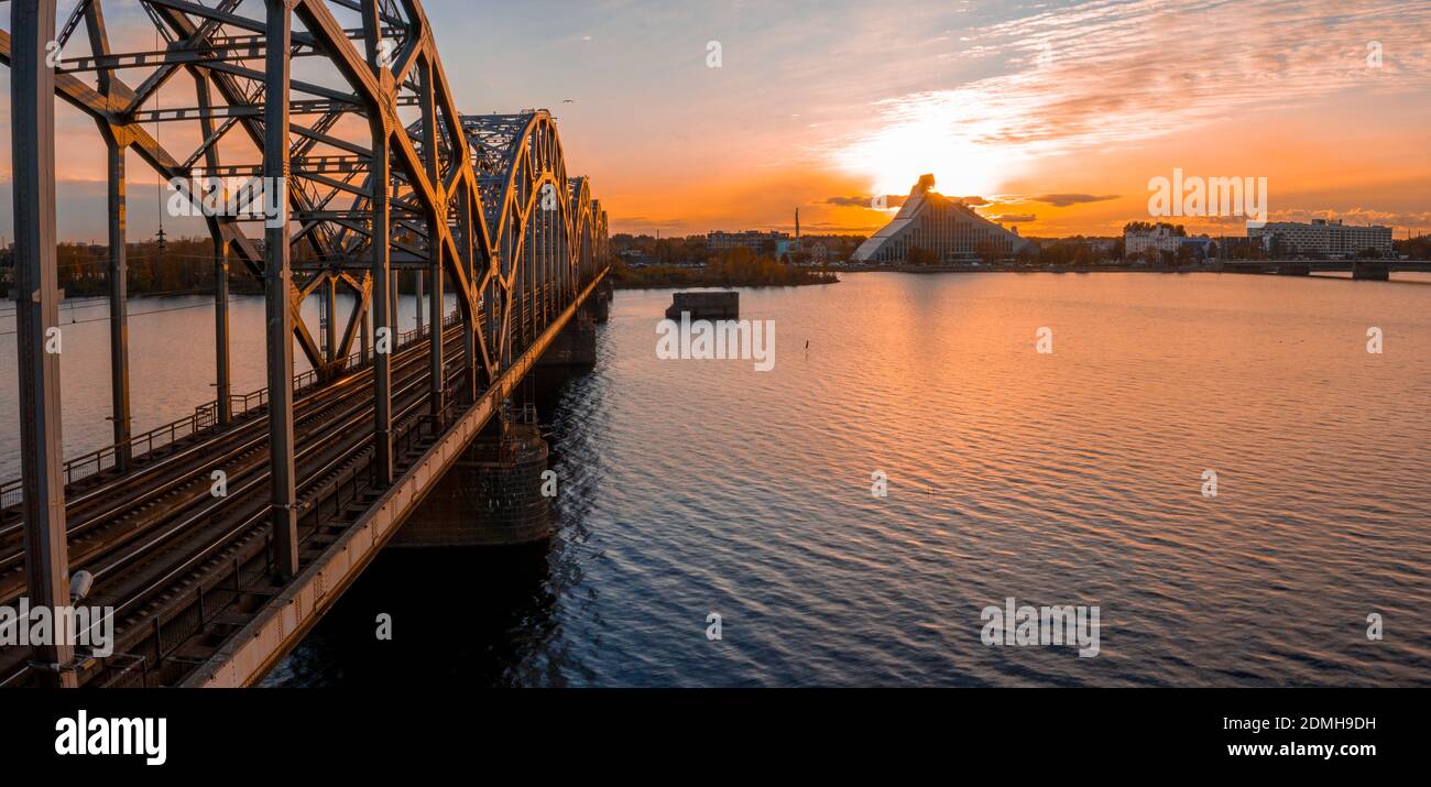 An aerial panoramic view of the iron train bridge across river Daugava ...