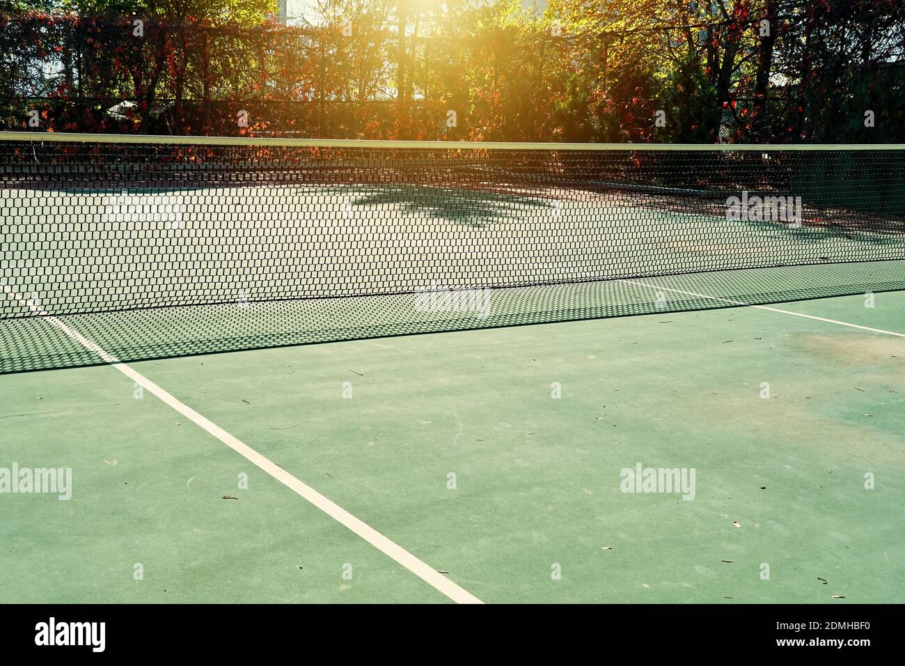 Clay or hard surface outdoor tennis court with net Stock Photo - Alamy