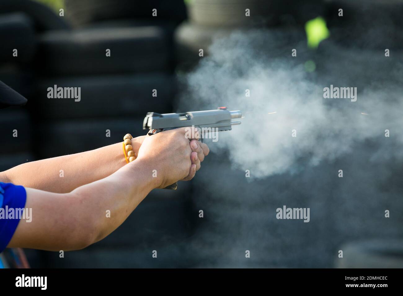 Hand gun smoke hi-res stock photography and images - Alamy