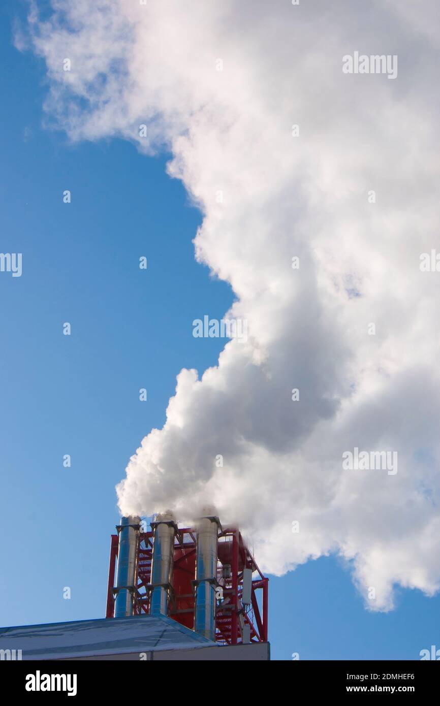 Pipes with white smoke. Pipes of a city gas boiler room with white ...