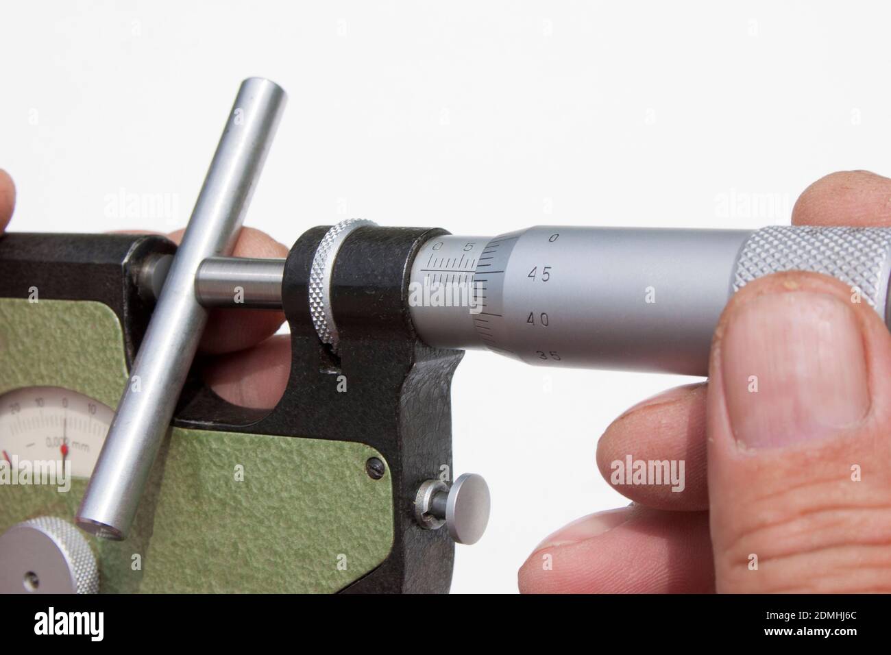 Shaft diameter measurement with a micrometer. Men's hands measure the ...
