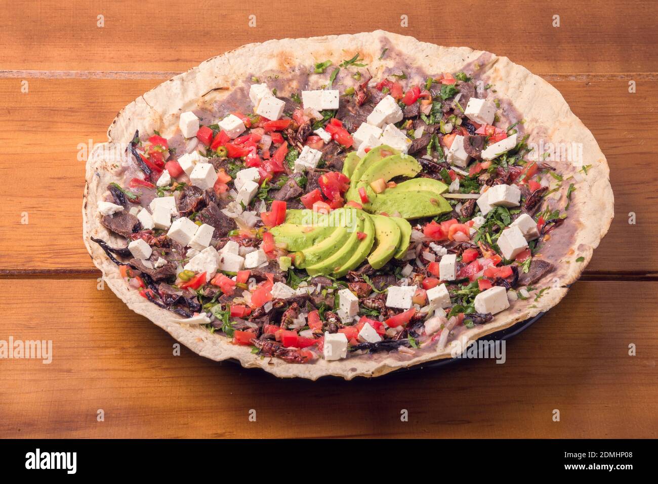 A traditional Mexican gourmet food tlayuda from Oaxaca Stock Photo - Alamy