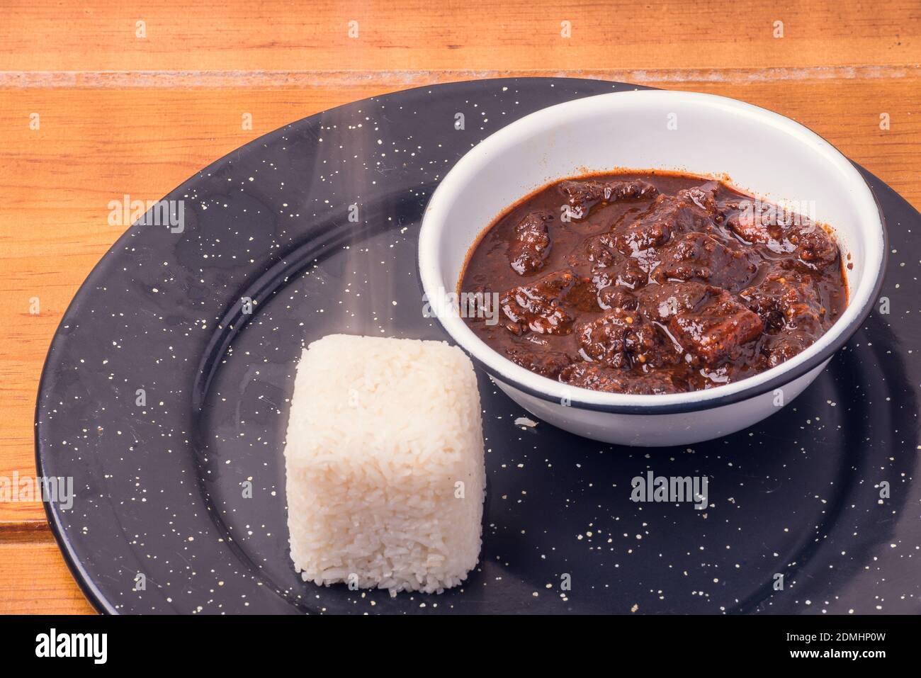 A traditional Mexican gourmet food mole with rice Stock Photo - Alamy