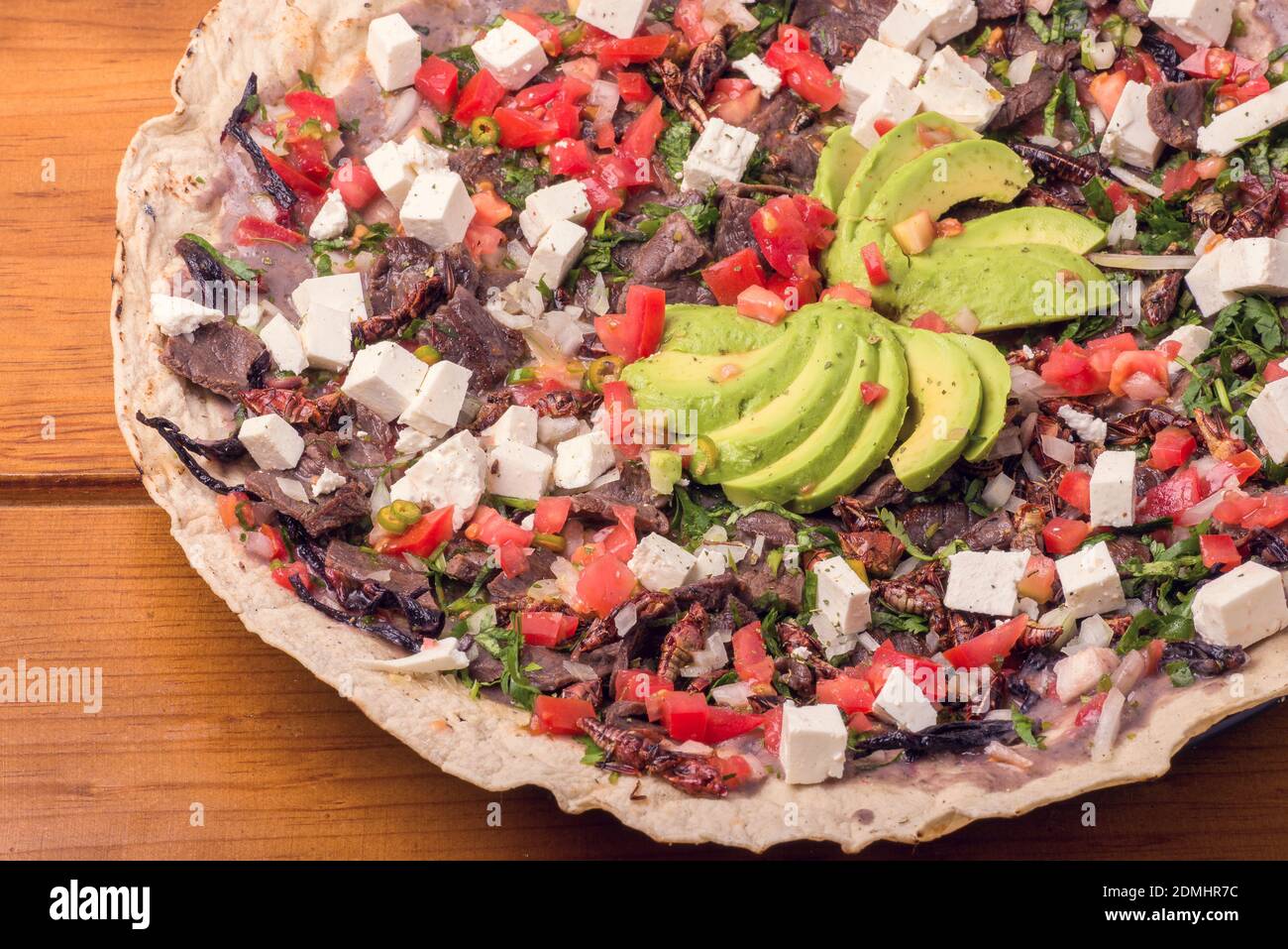 A traditional Mexican gourmet food tlayuda from Oaxaca Stock Photo - Alamy