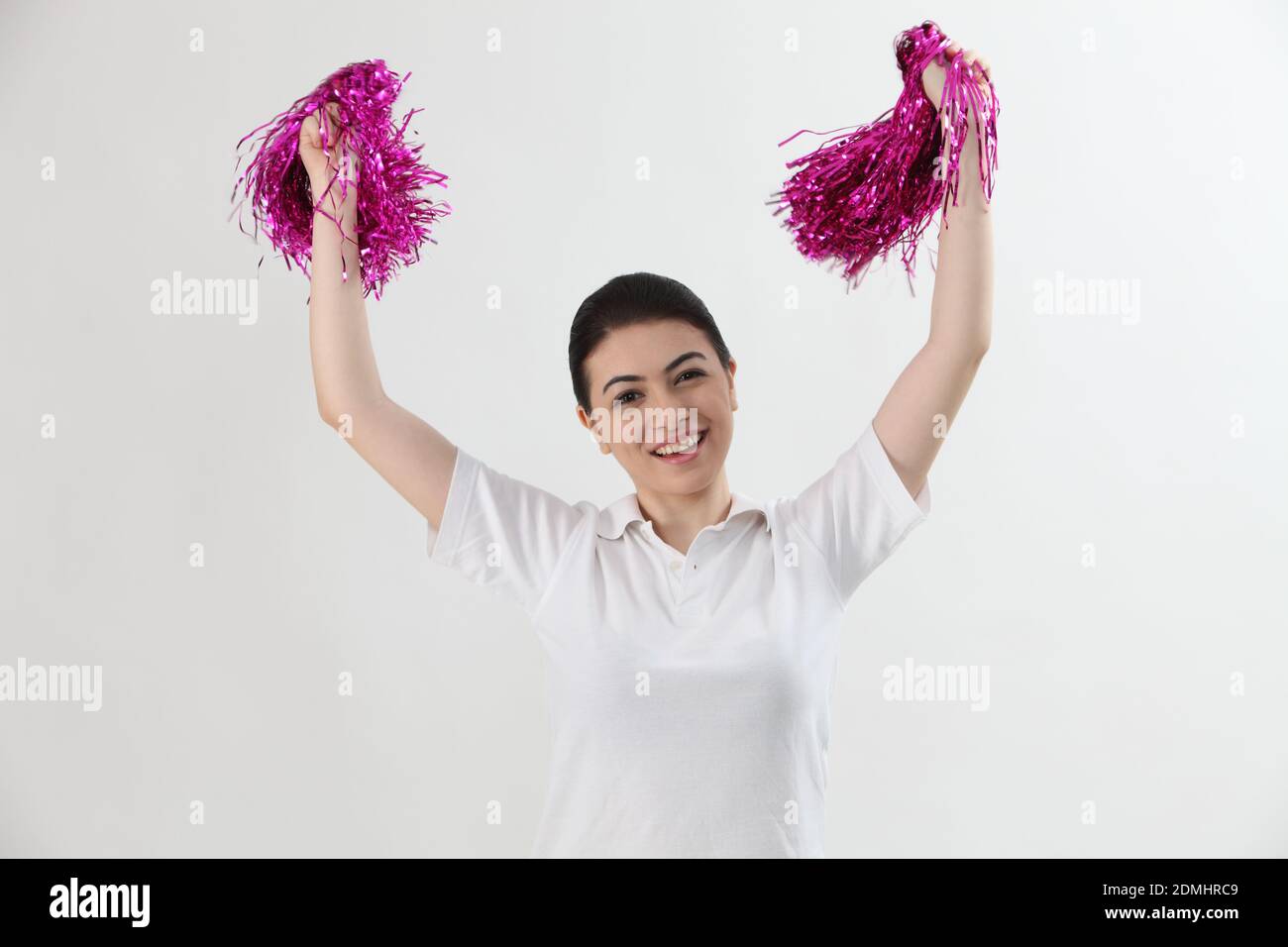 Cheerleader holding pom poms hi-res stock photography and images - Alamy