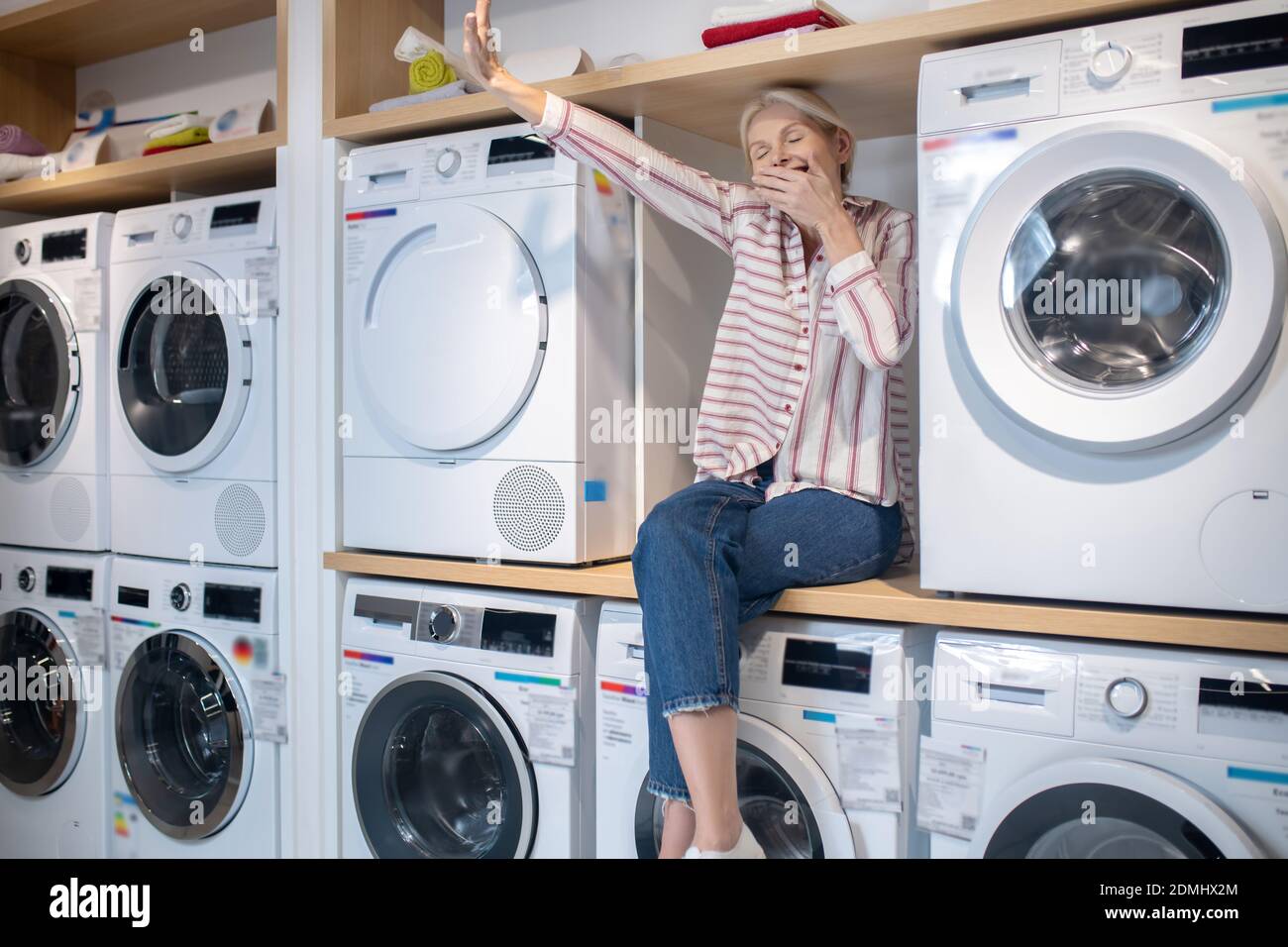 Sitting on the washing machine hi-res stock photography and images - Alamy