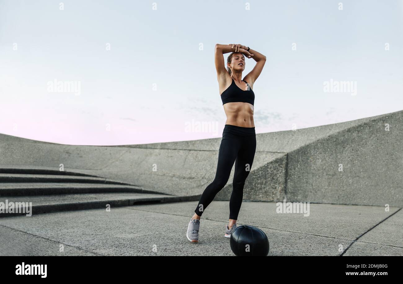 Female in sportswear feeling exhausted after intense training. Woman ...