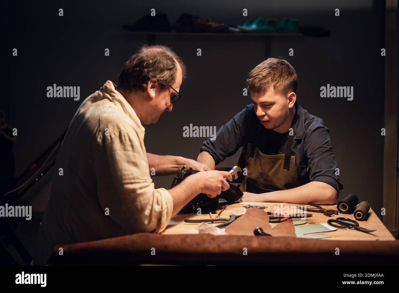 a cute young guy wants to make a gift with his own hands, an ...