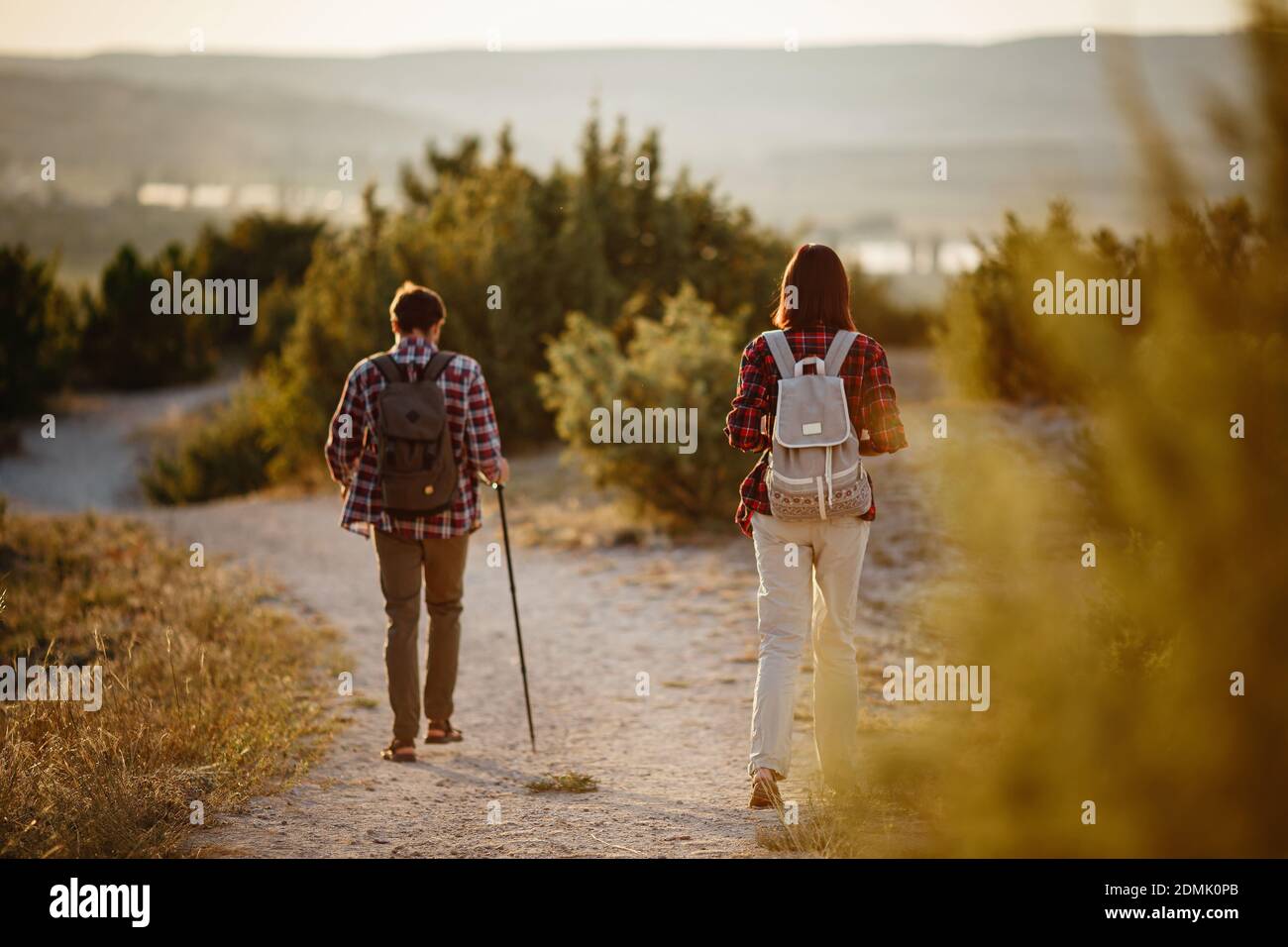 Portrait of happy young couple having fun on their hiking trip ...