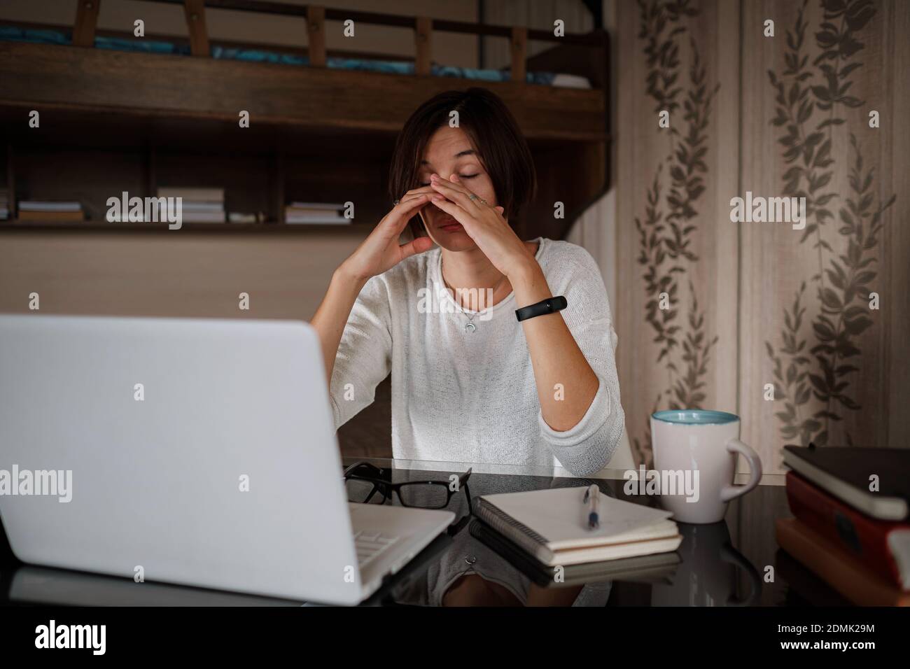 Thoughtful doubtful asian female student worker looking away thinking ...