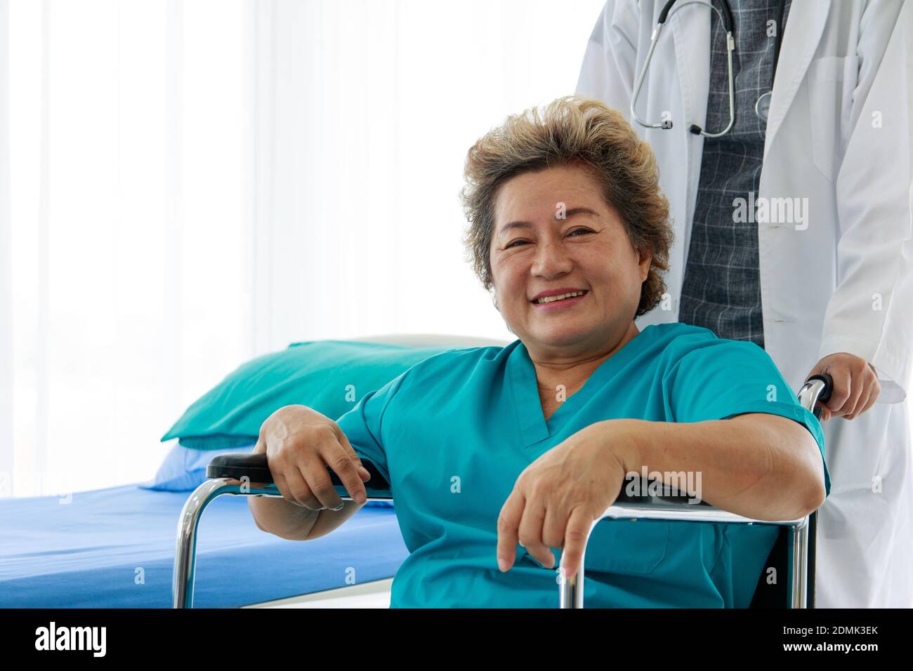 Smiling Patient With Doctor At Clinic Stock Photo - Alamy