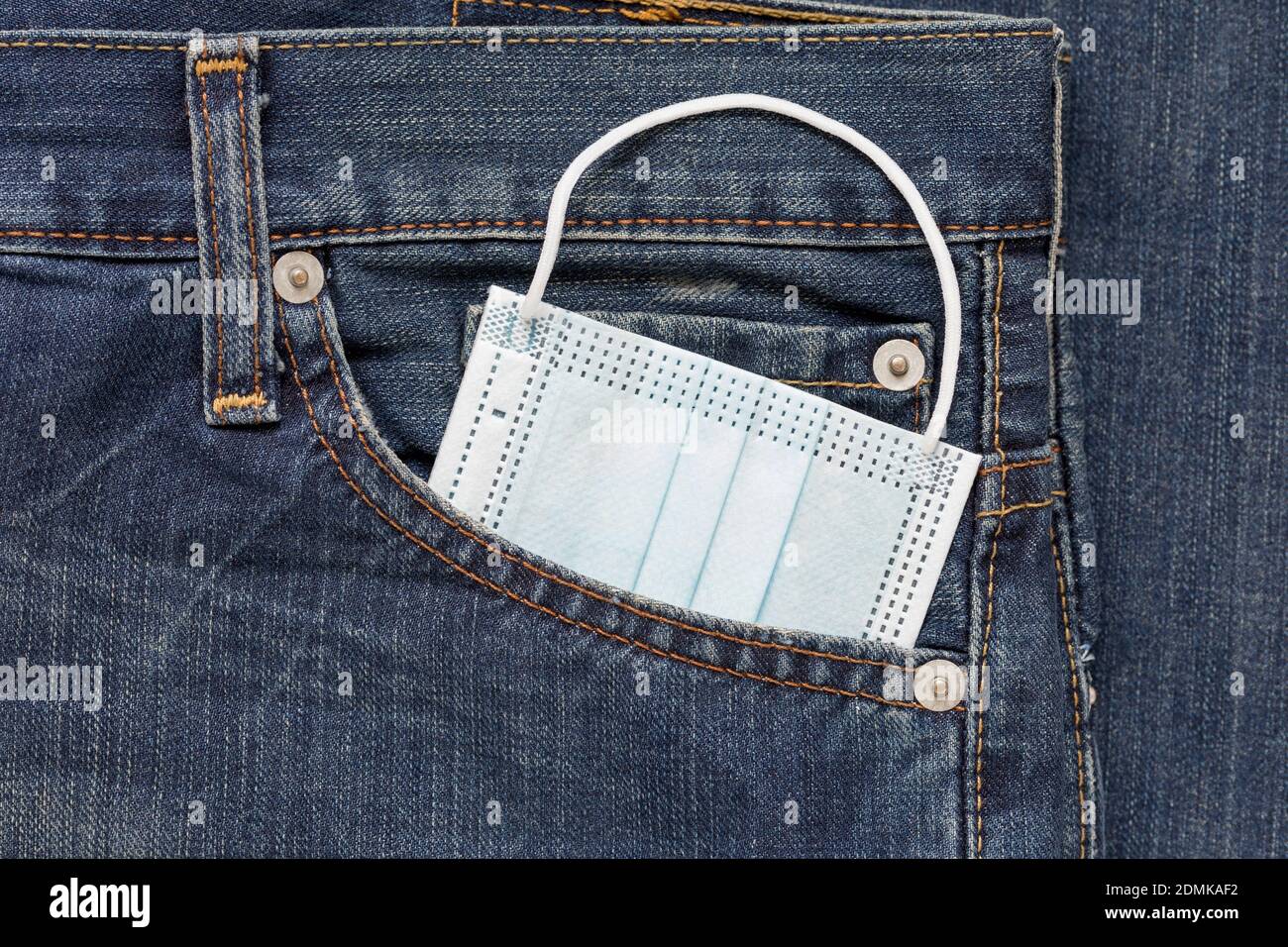 Protective face mask is lying in side pocket of jeans. Concept for new ...