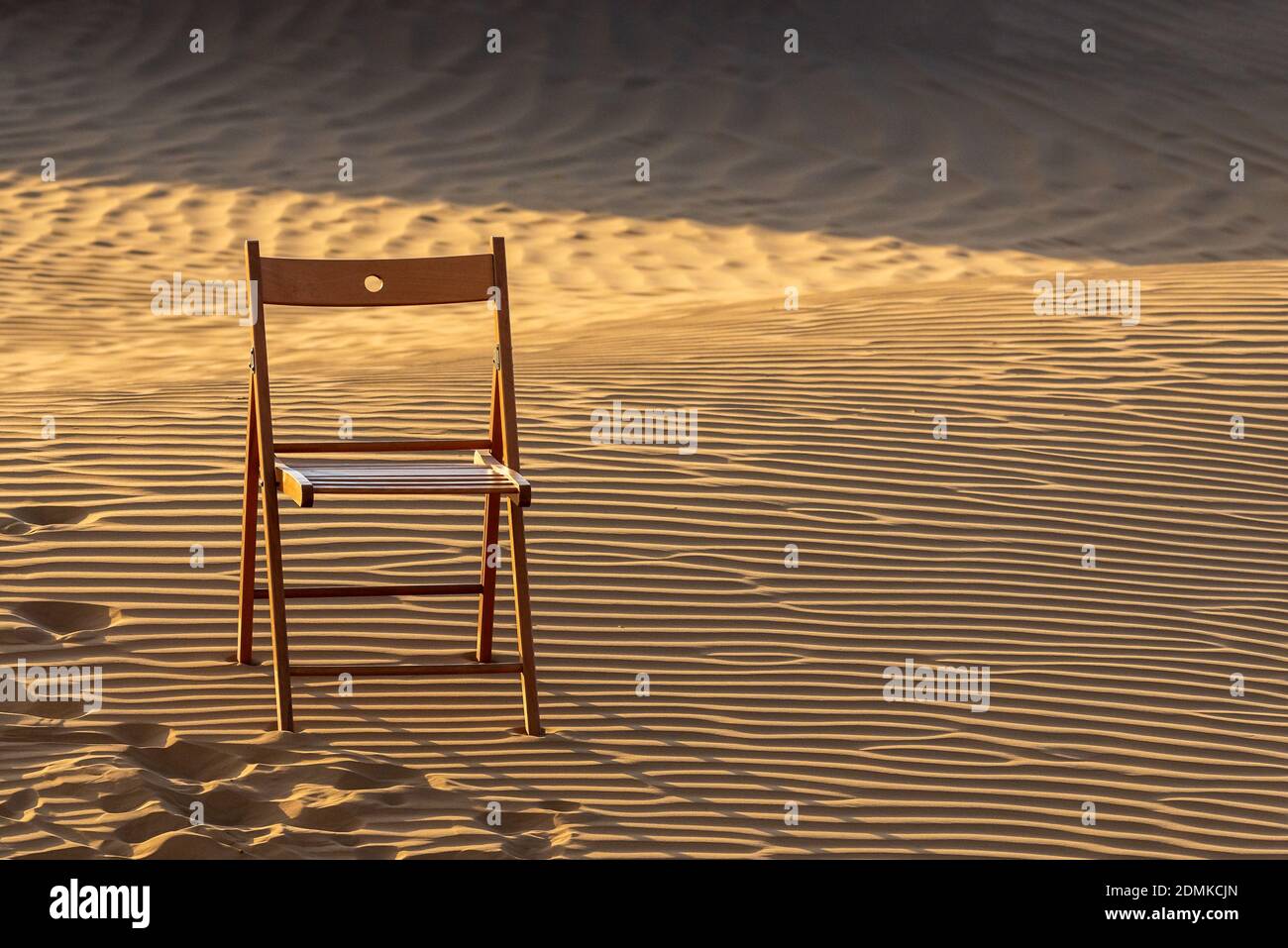 Chair for tourist on sand among dune in desert Stock Photo - Alamy