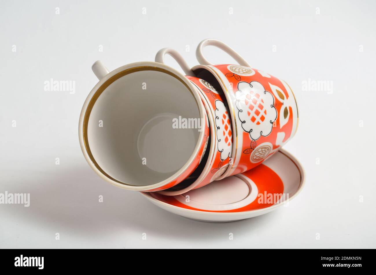Stack of retro cups on a white background Stock Photo - Alamy