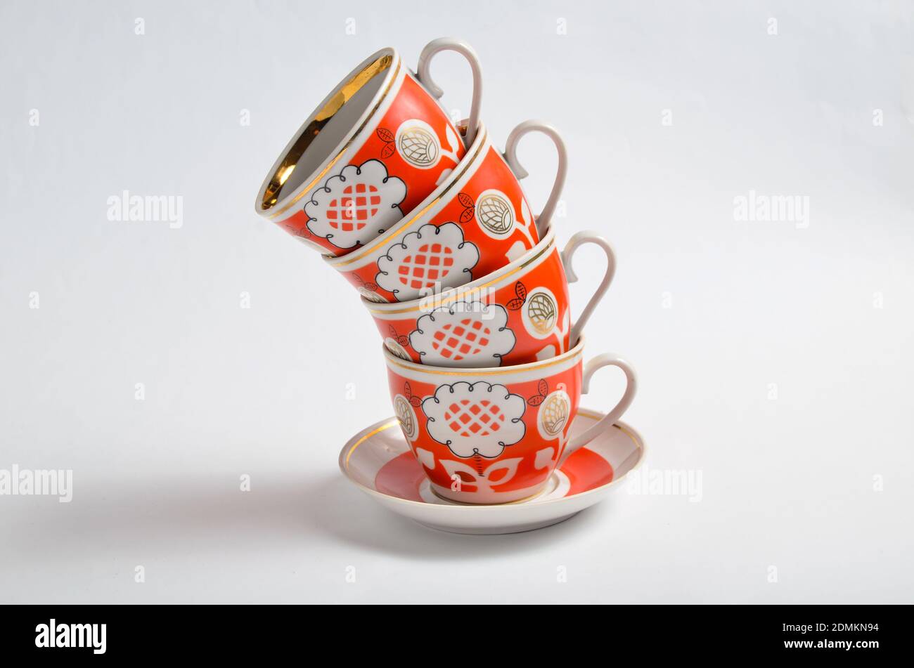 Stack of retro cups on a white background Stock Photo - Alamy