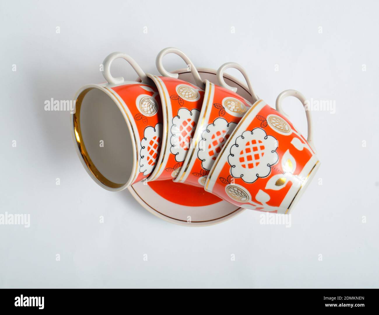 Stack of retro cups on a white background Stock Photo - Alamy