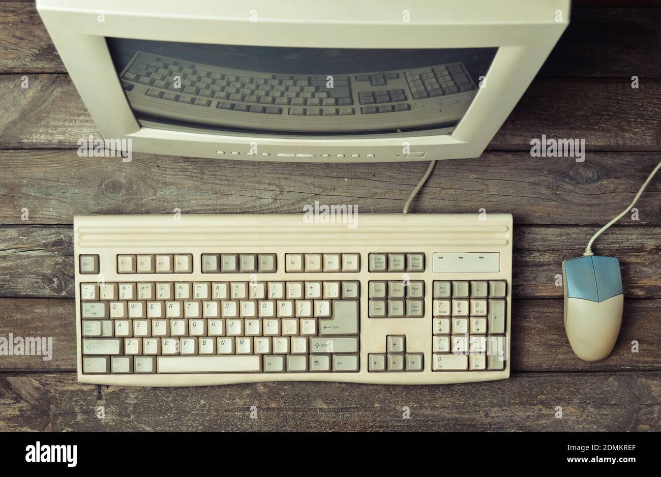 Retro stationary computer on a rustic wooden desk, vintage workspace ...