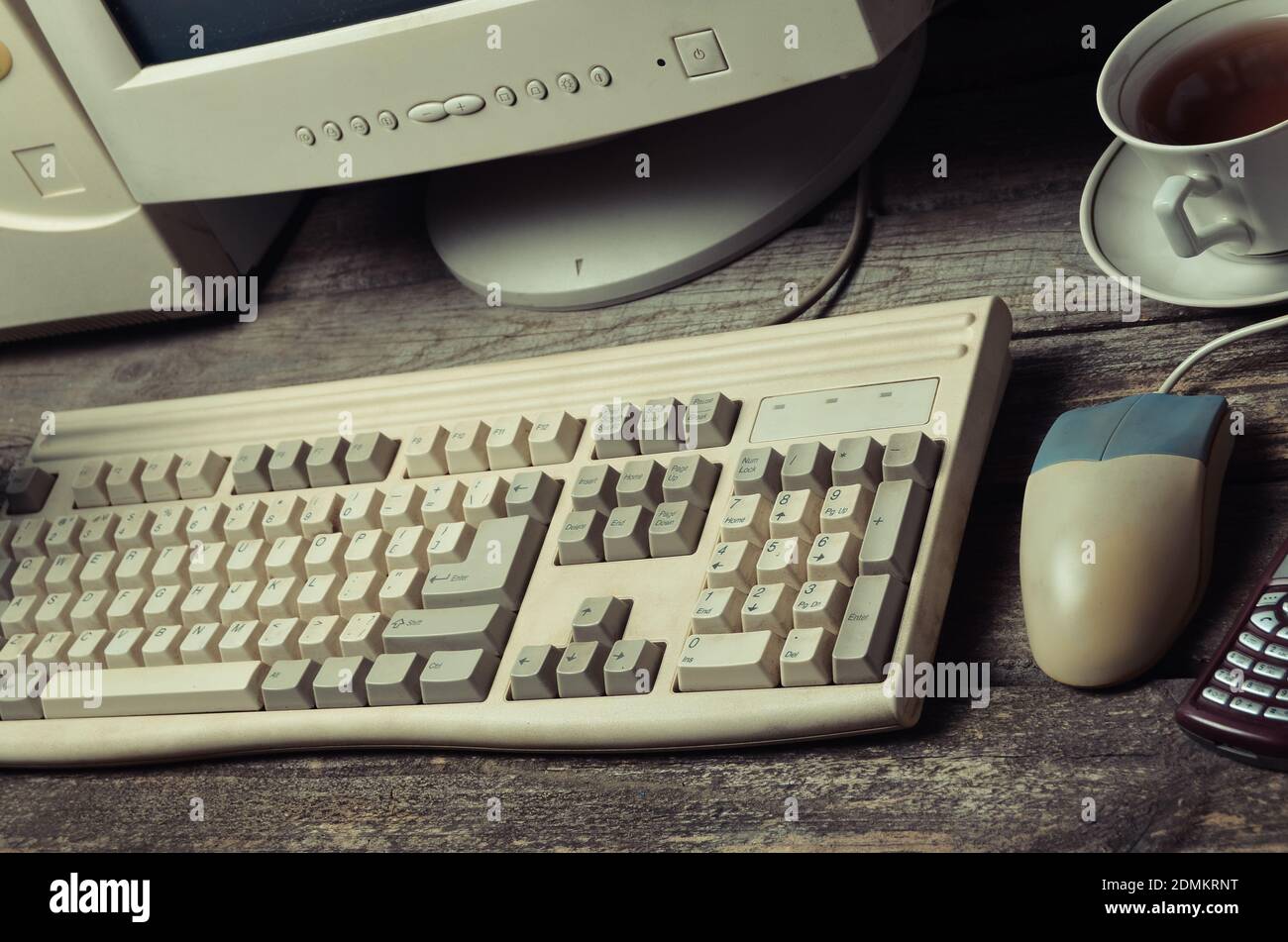 Retro stationary computer on a rustic wooden desk, vintage workspace ...
