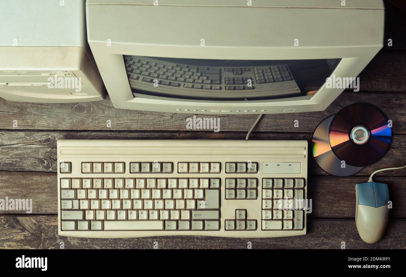 Retro stationary computer on a rustic wooden desk, vintage workspace ...