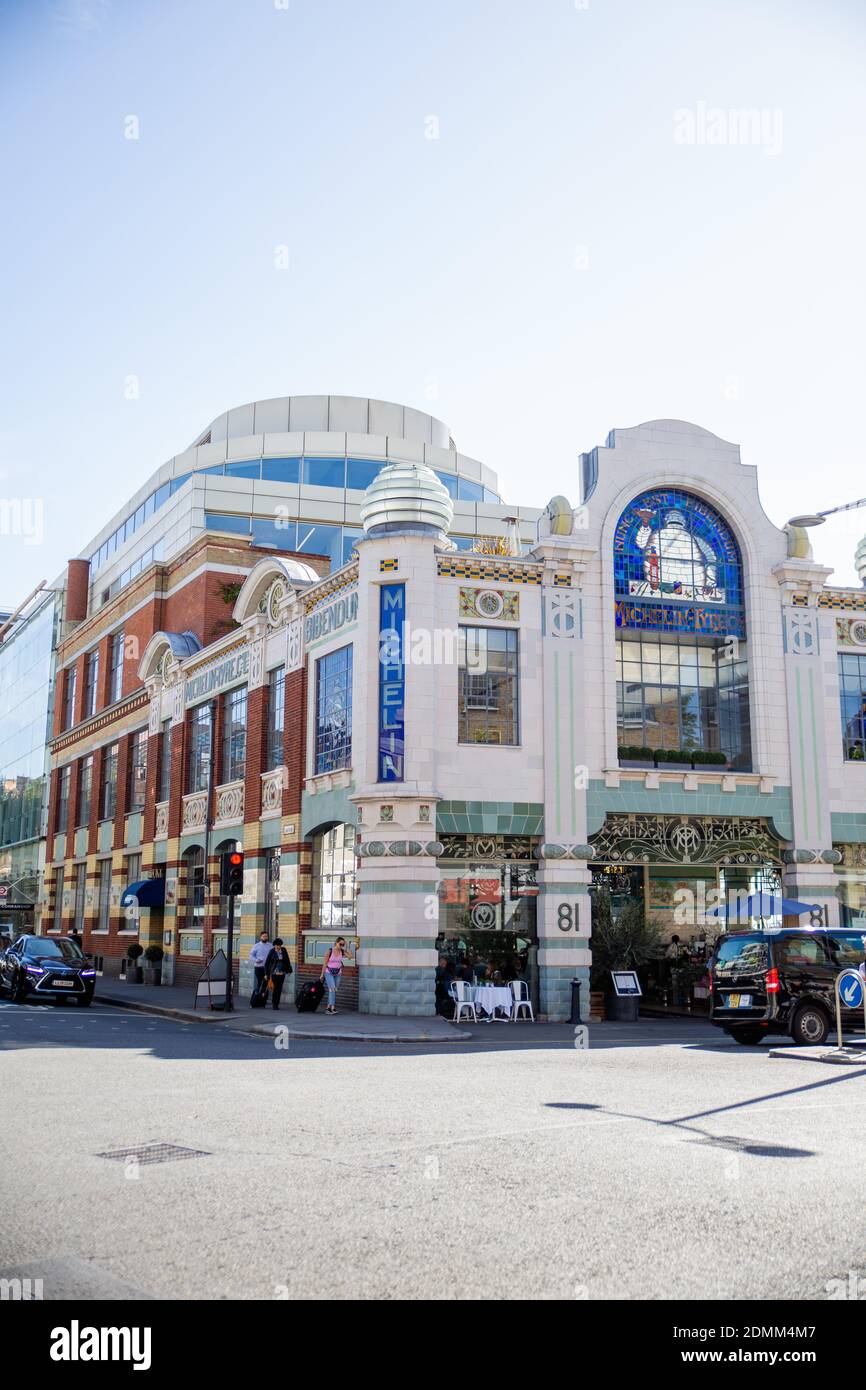 The Michelin House with pedestrians and vehicles passing by Stock Photo ...