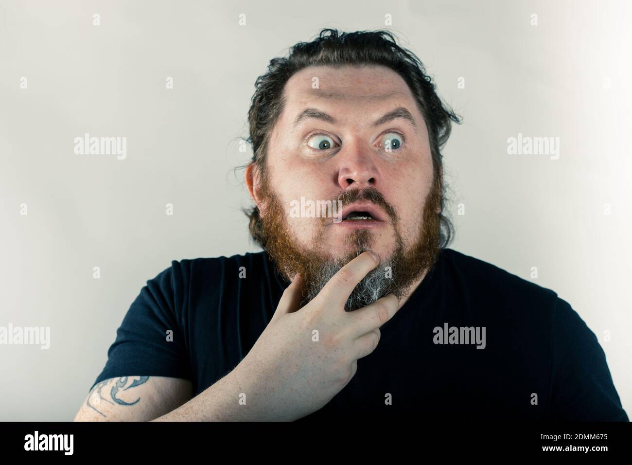 Close-up Of Angry Man Making Face Against White Background Stock Photo ...