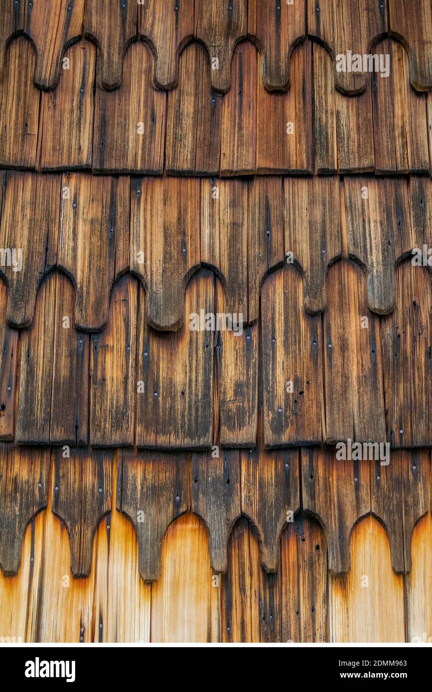 full frame closeup shot showing a weathered wooden shingles background ...